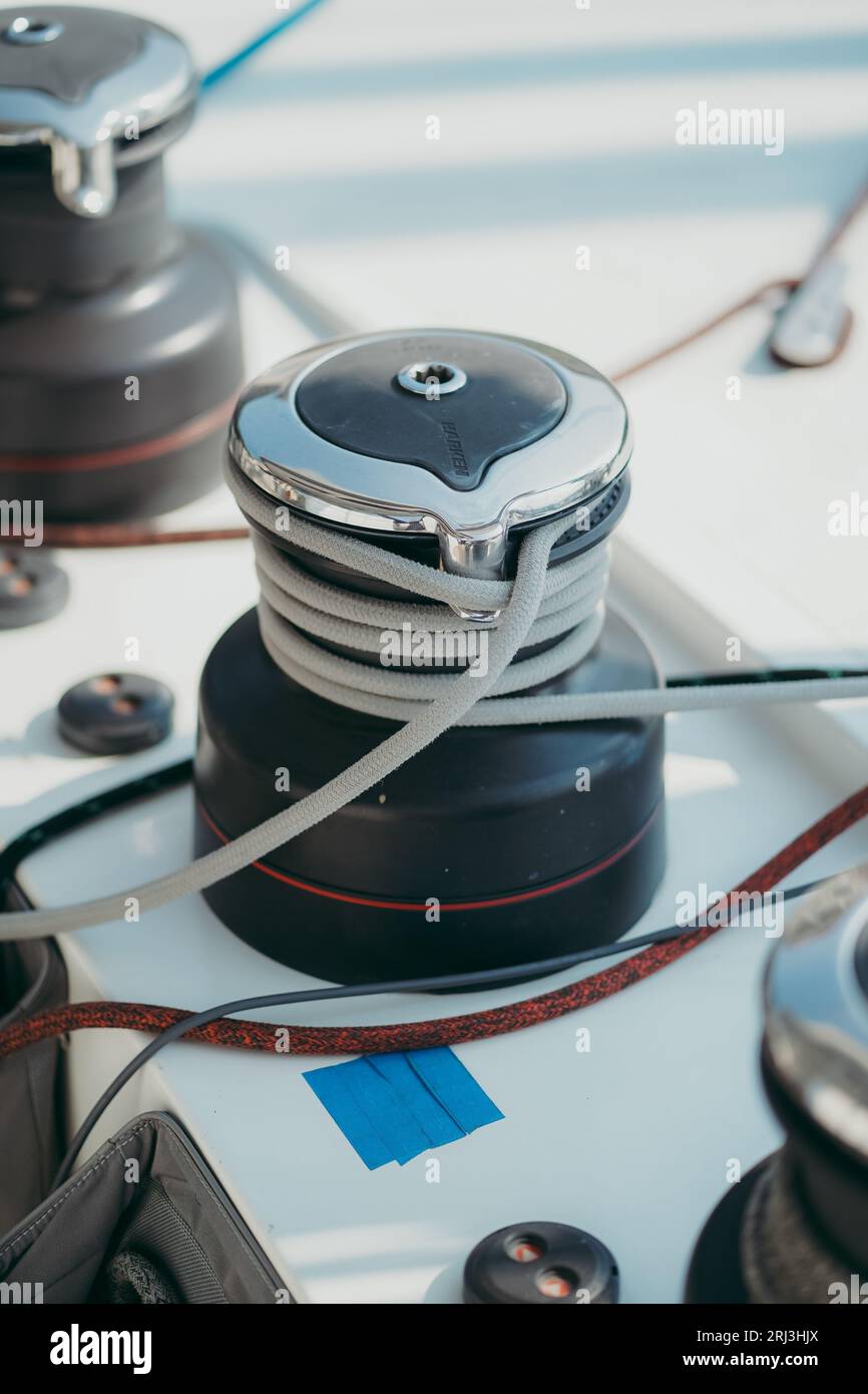 An array of black and silver objects, sitting atop the deck of a boat ...