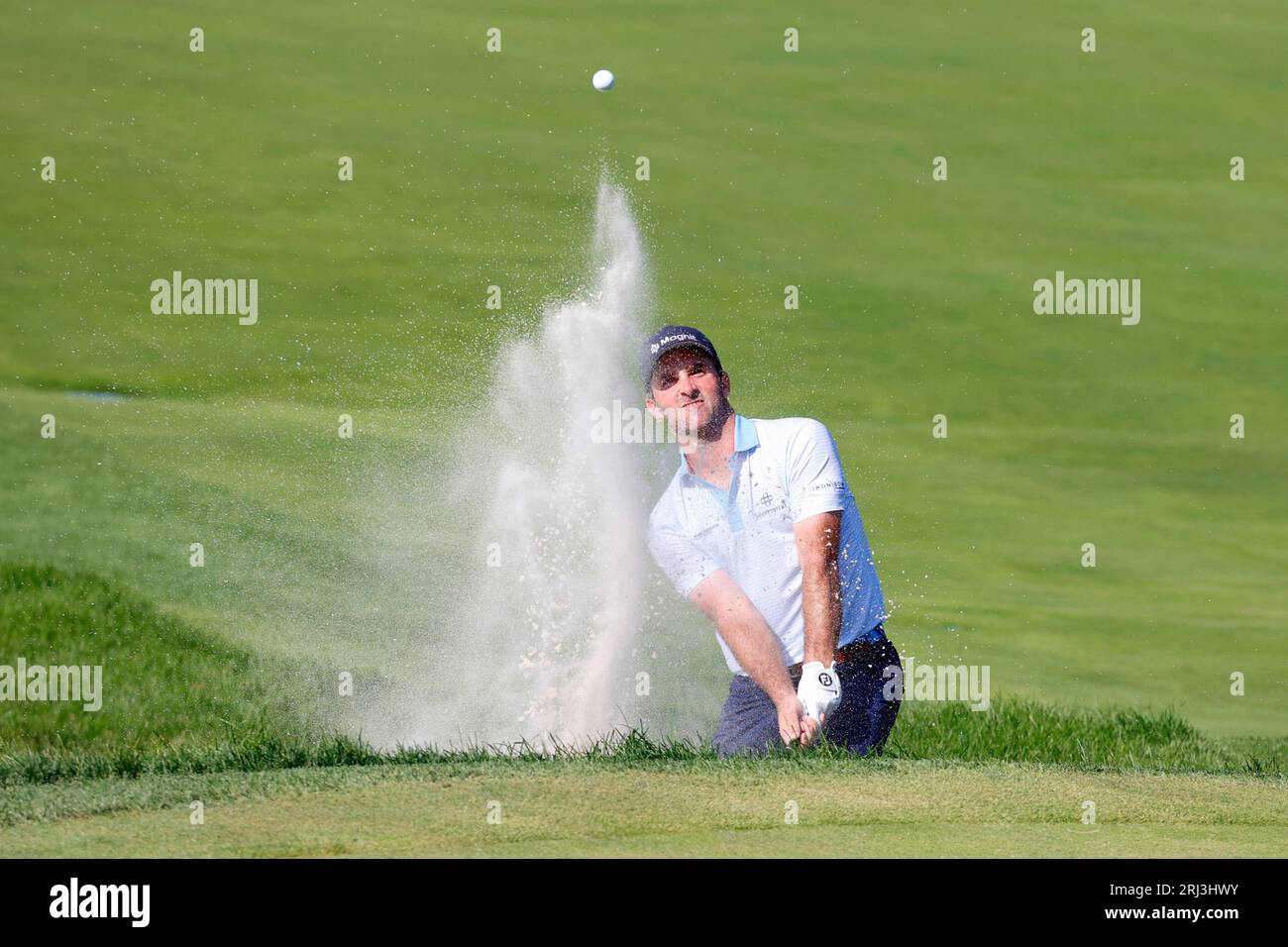OLYMPIA FIELDS, IL - AUGUST 20: PGA golfer Denny McCarthy hits out of a green side bunker on the ...