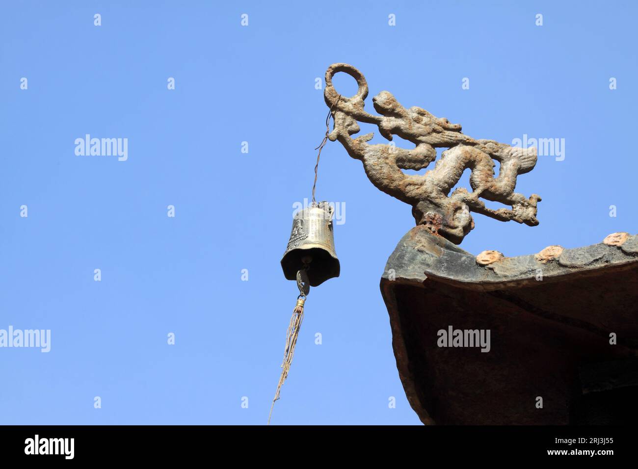 Wind chimes in the eaves in a temple, China Stock Photo - Alamy