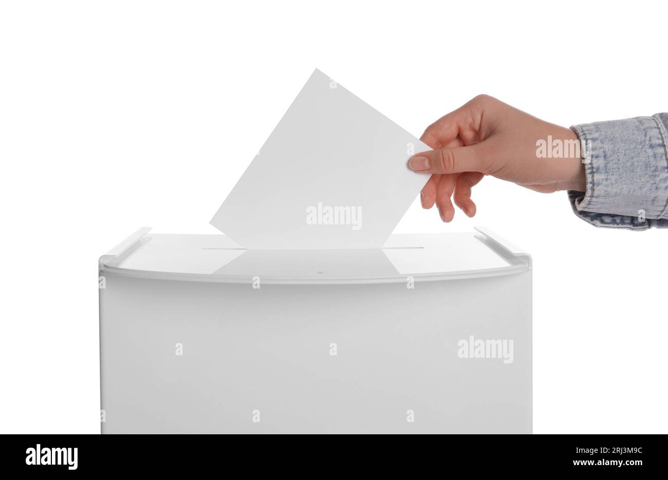 Woman putting her vote into ballot box on white background, closeup ...