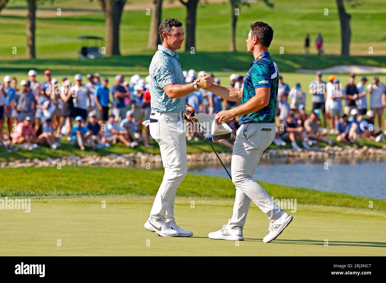 OLYMPIA FIELDS, IL - AUGUST 20: PGA golfer Rory McIlroy and Viktor Hovland shake hands after ...