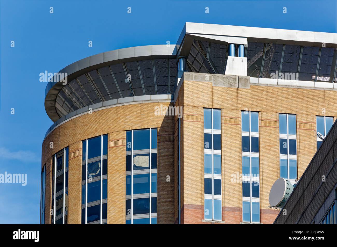 Brick-and-glass 77 West 66th Street wears a metal-screened cap in the ...