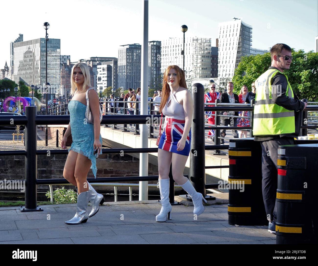 Group of cheerful young Eurovision Fans In Liverpool Wearing Colourful ...