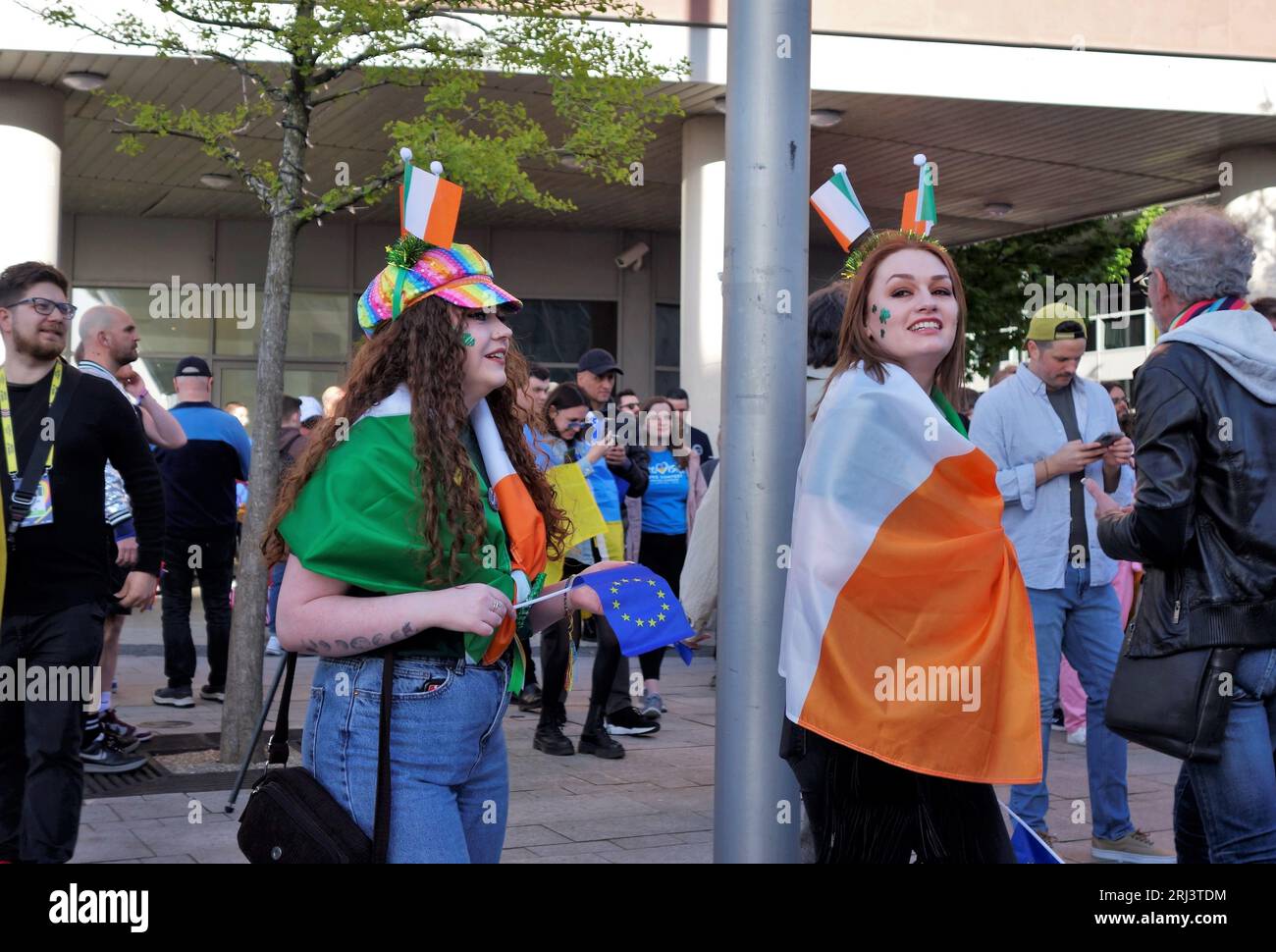 Group of cheerful young Eurovision Fans In Liverpool Wearing Colourful ...