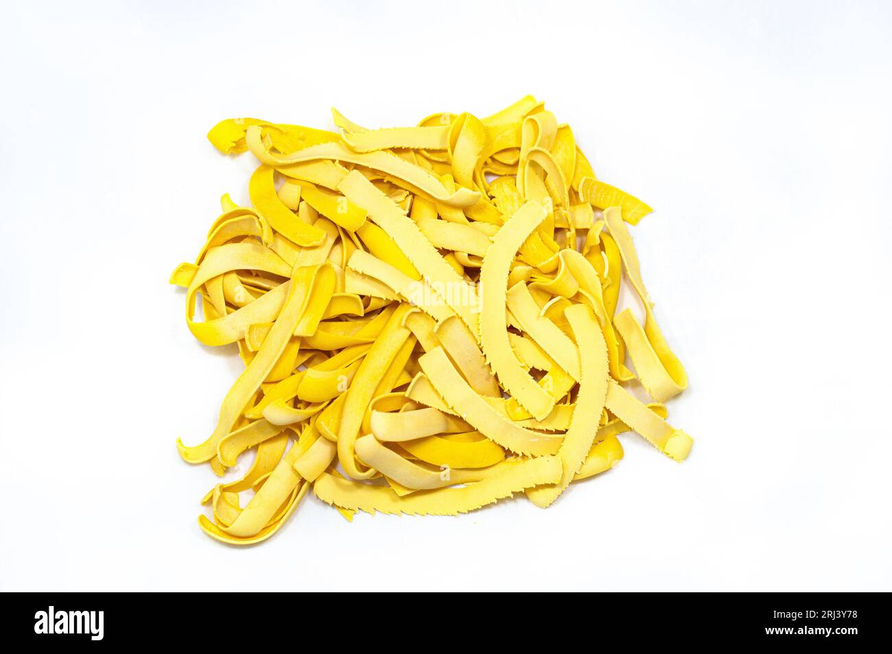 A close-up Raw Shell Shaped Pasta with a white background Stock Photo ...