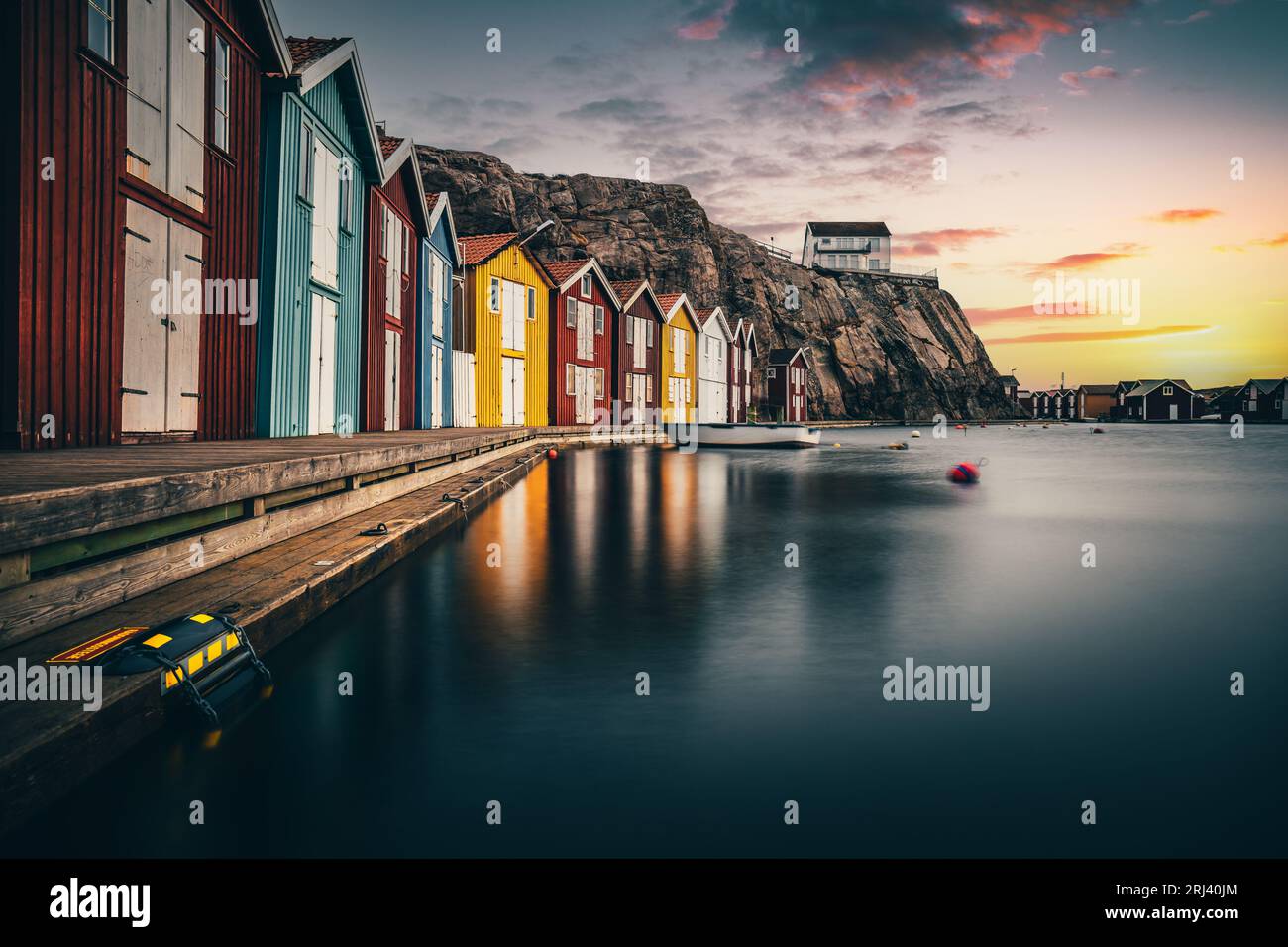 A closeup of colorful typical Swedish houses by the sea. Fishermen's ...