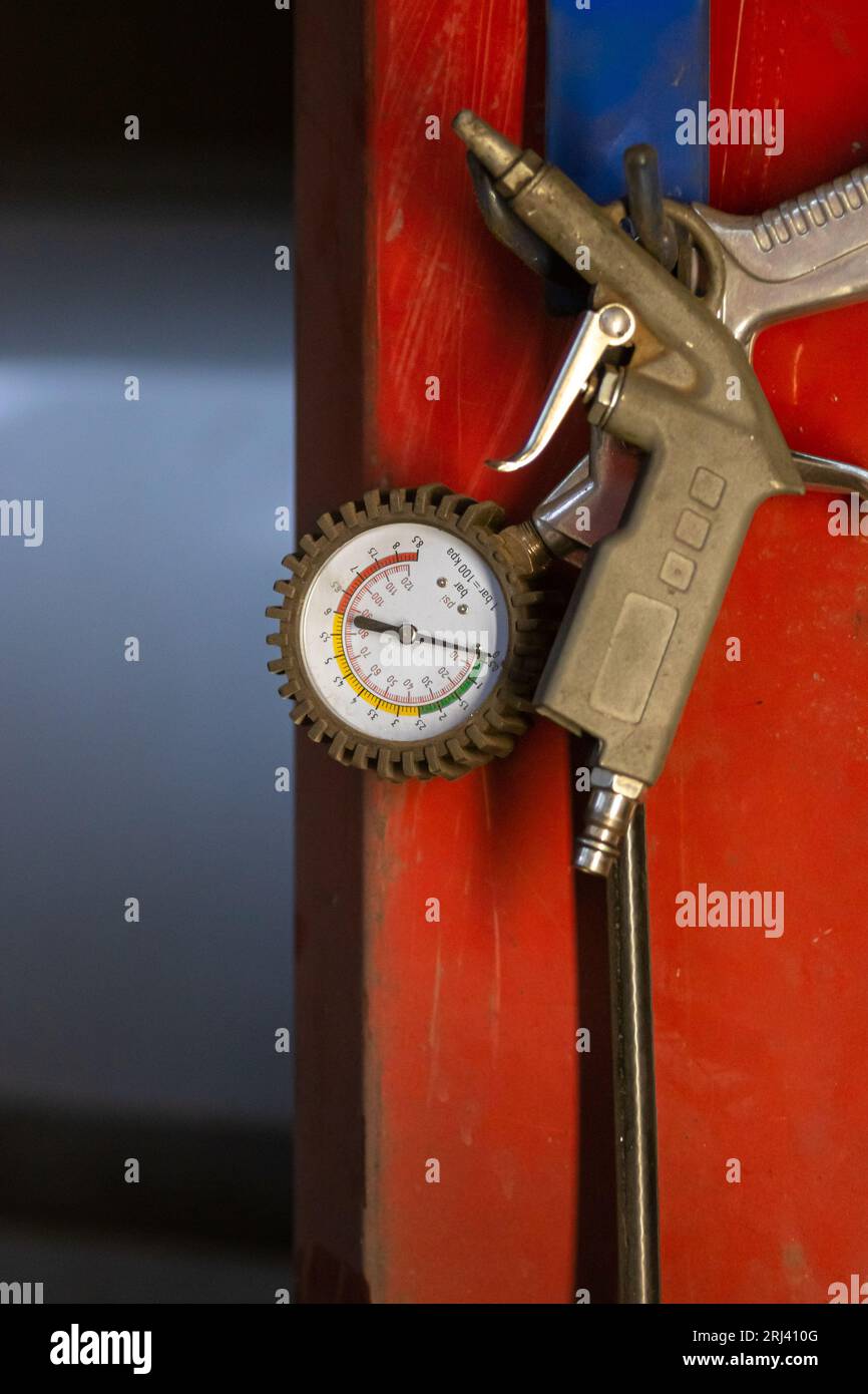 A closeup of a manometer in a car garage with a blurry background Stock ...
