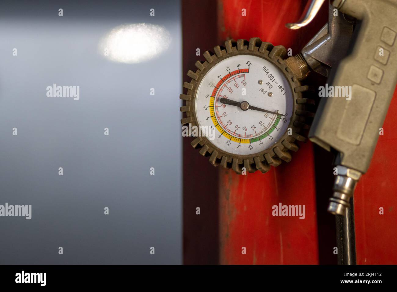 A closeup of a manometer in a car garage with a blurry background Stock ...