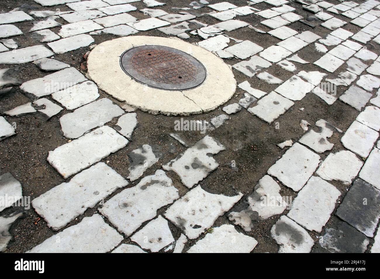 metal catch basin manhole cover in the street in China Stock Photo - Alamy