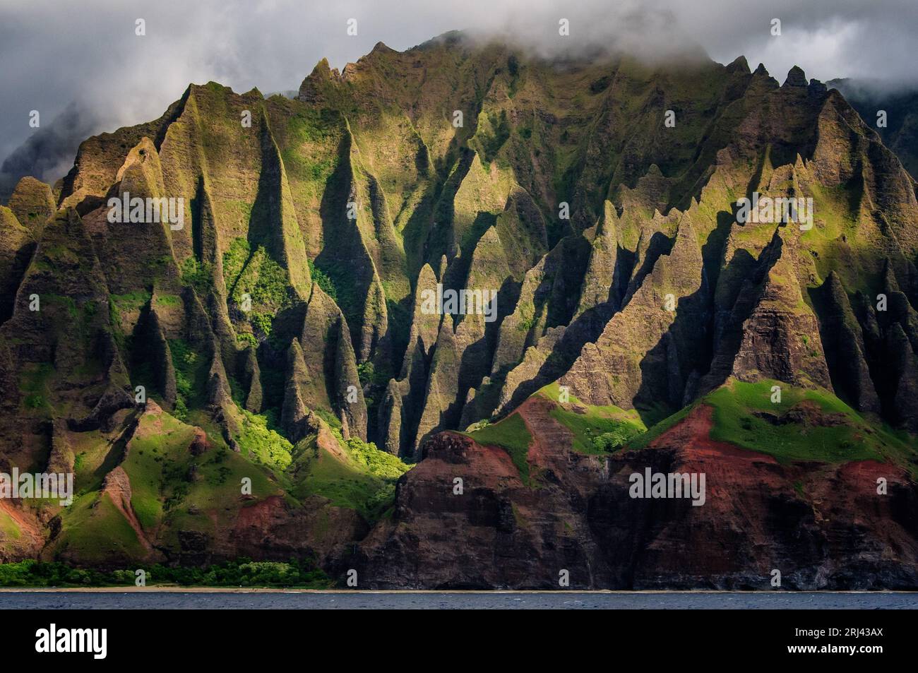 A stunning view of Na Pali Coast in Kauai, Hawaii, featuring a lush ...