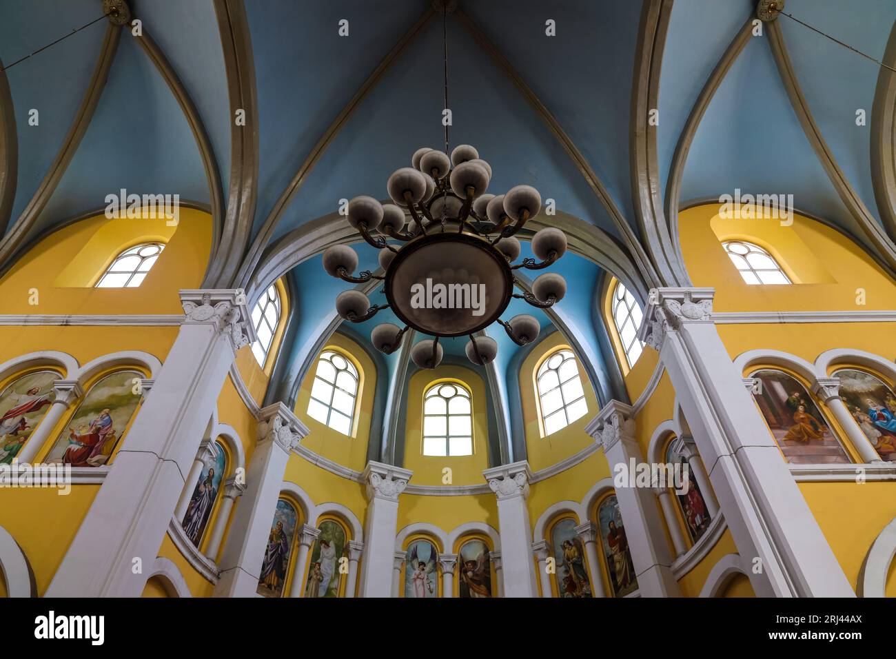 The interior of a cathedral with high vaulted ceilings and grand ...