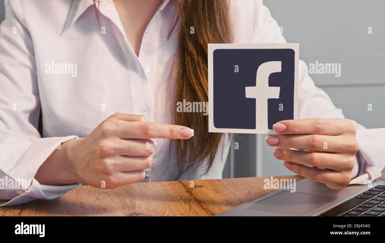 Facebook logo social media female hands pointing Stock Photo - Alamy