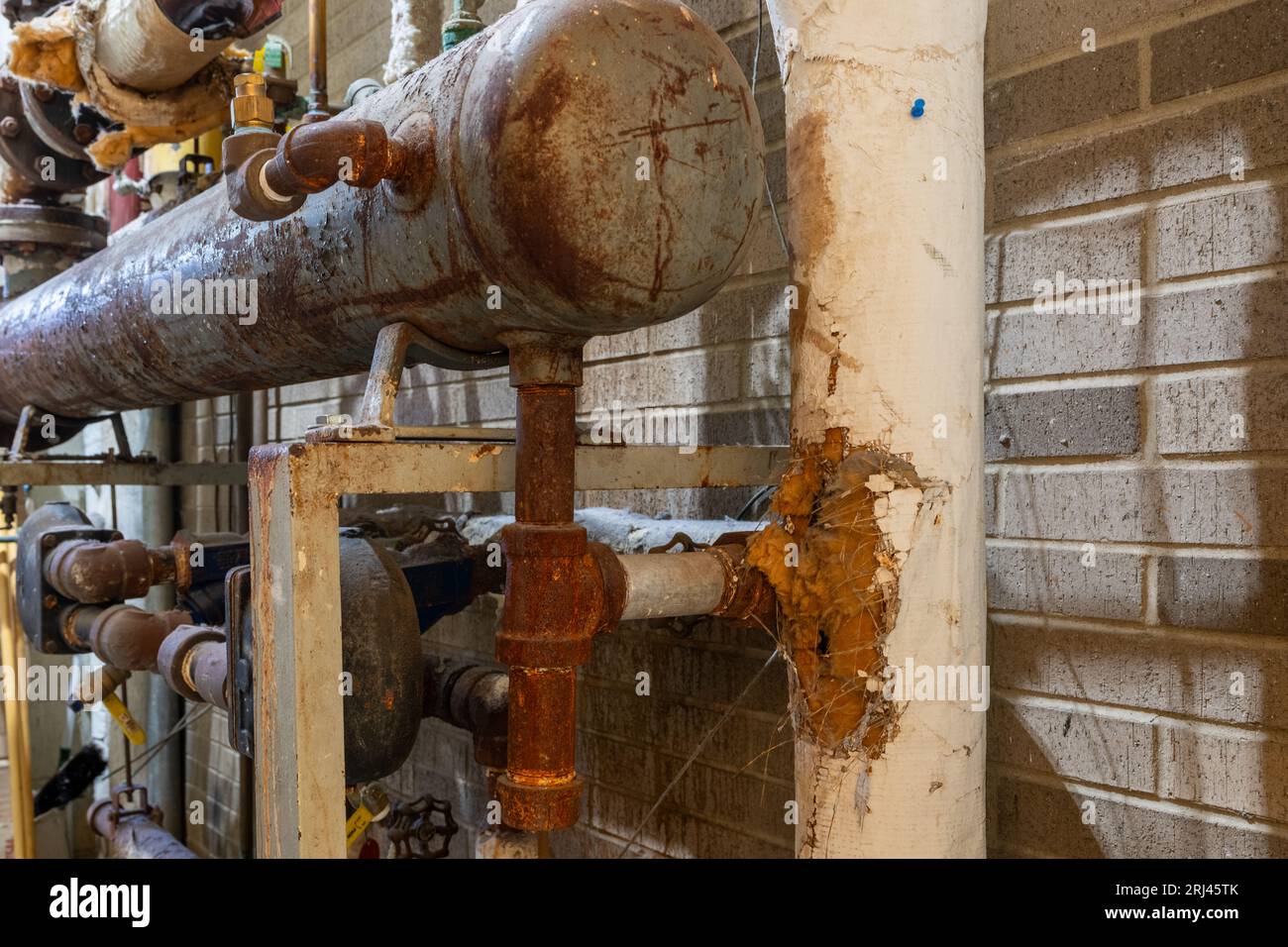 Old corrosion rusty valve piping, tank, steam HVAC heating system ...