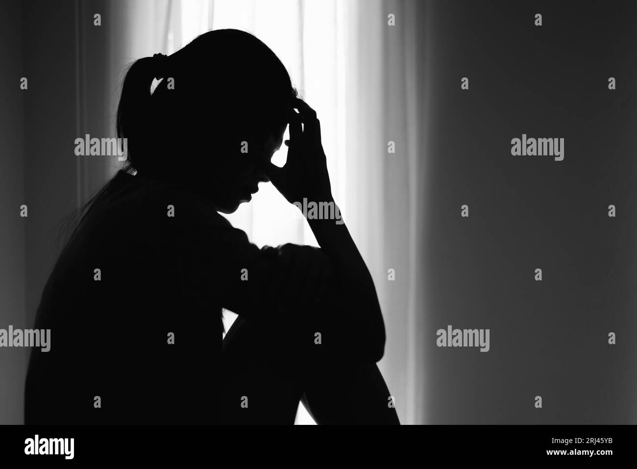 Asian woman sitting on the house area Feeling sad, tired and worried ...