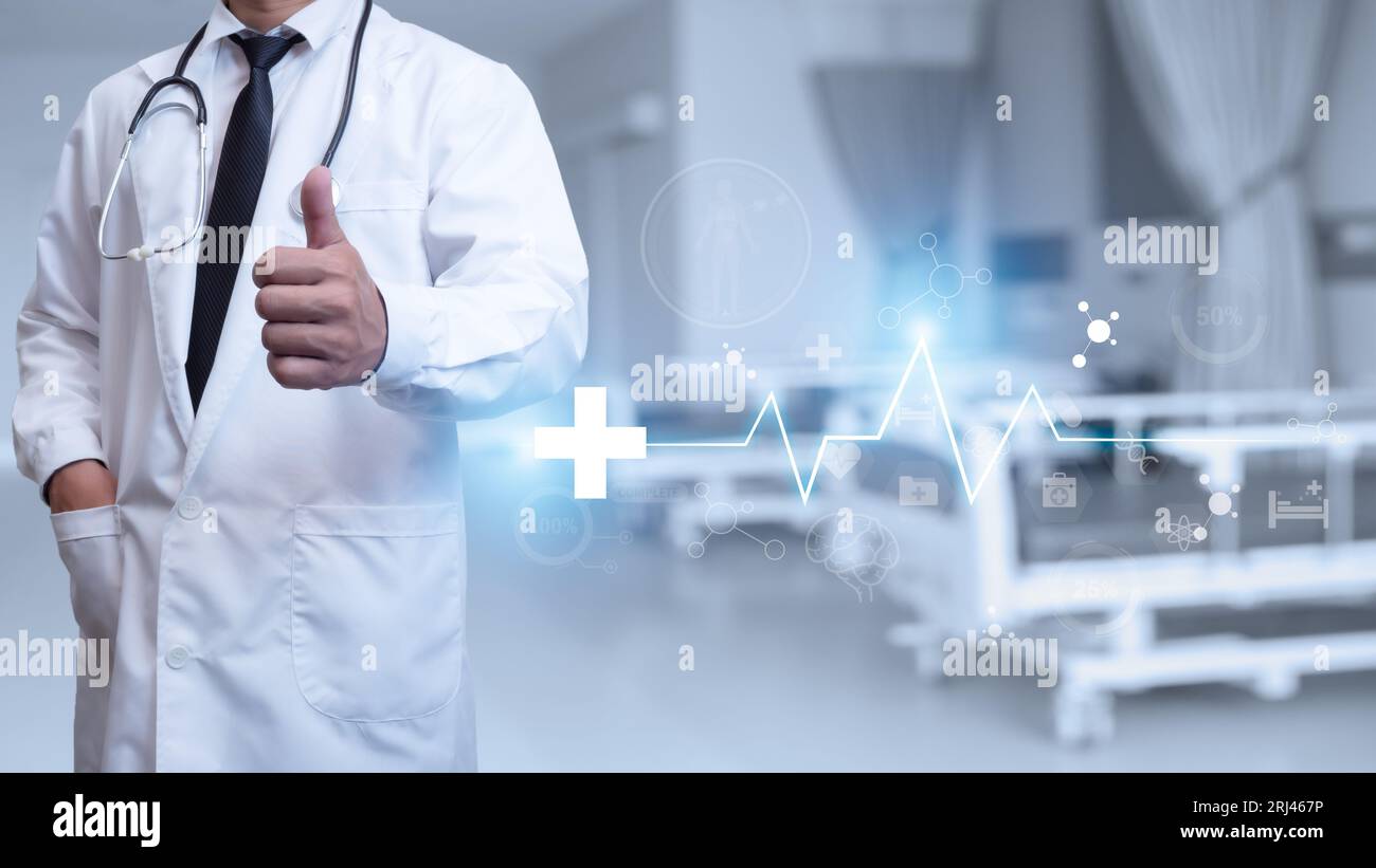 Doctor in lab coat is showing thumb up on background in hospital ...