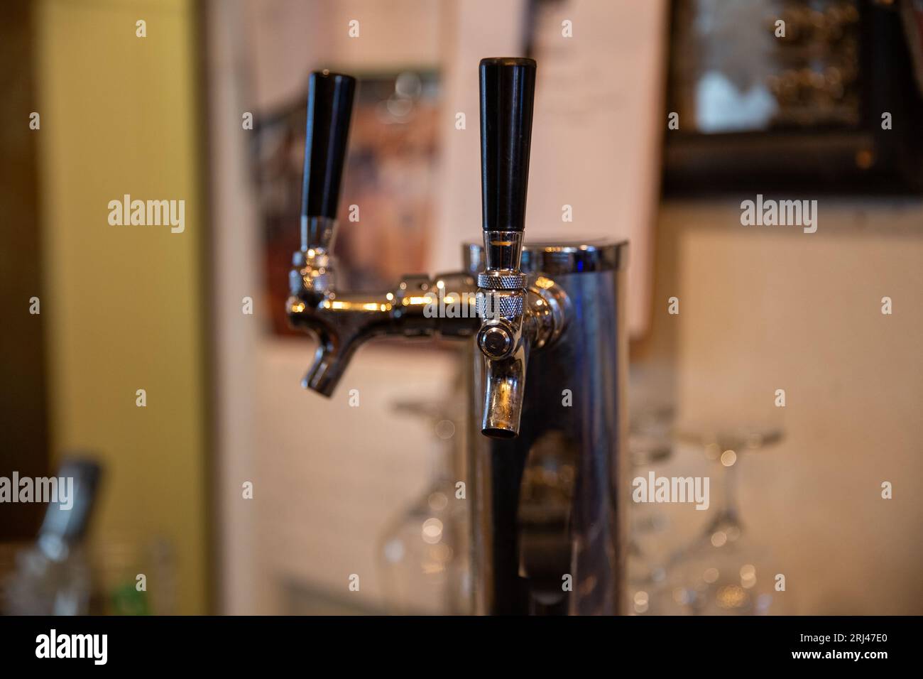 Couple of alcohol taps at a bar Stock Photo - Alamy