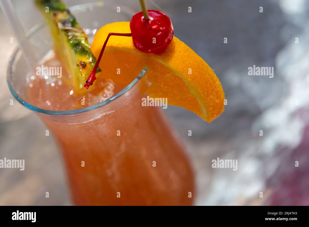 Tropical fruit punch with garnishes shot close up Stock Photo - Alamy