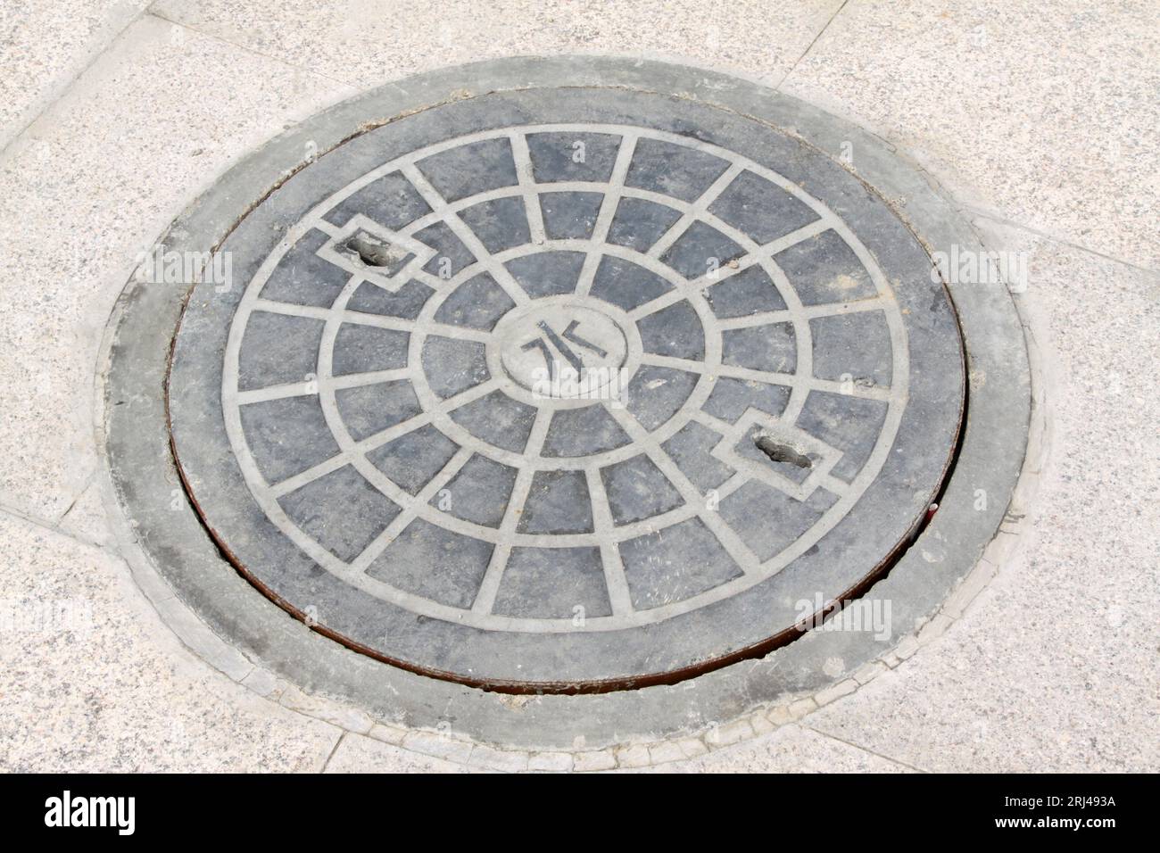 metal catch basin manhole cover in the street in China Stock Photo - Alamy