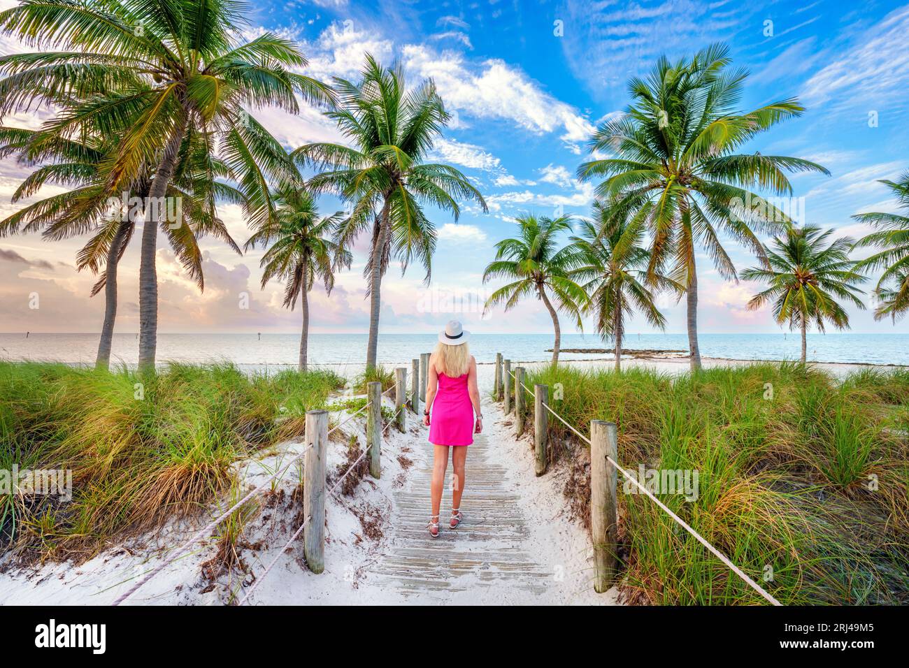 A young woman enjoying a sunny day at Smathers Beach in Key West ...