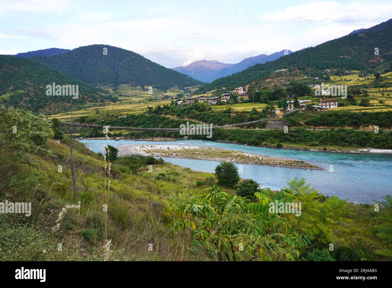 View of Pho Chhu River valley with forested mountains in the distance ...