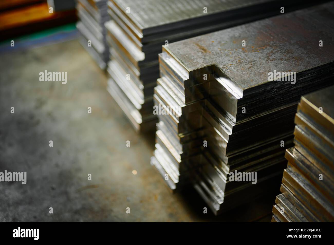 Steel details with ground edges and corners in storage Stock Photo - Alamy