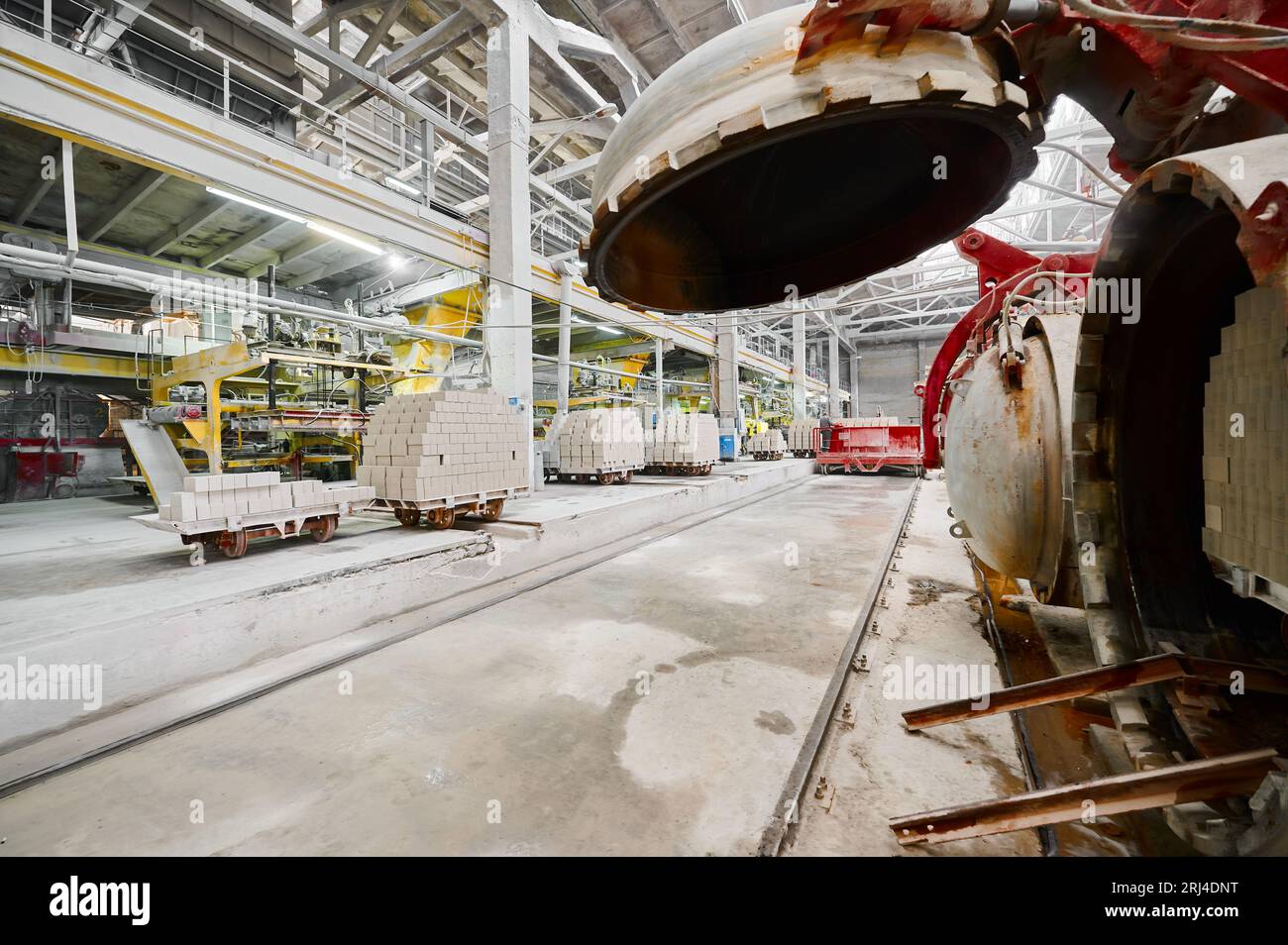Raw bricks loaded into open autoclave for hardening in shop Stock Photo ...
