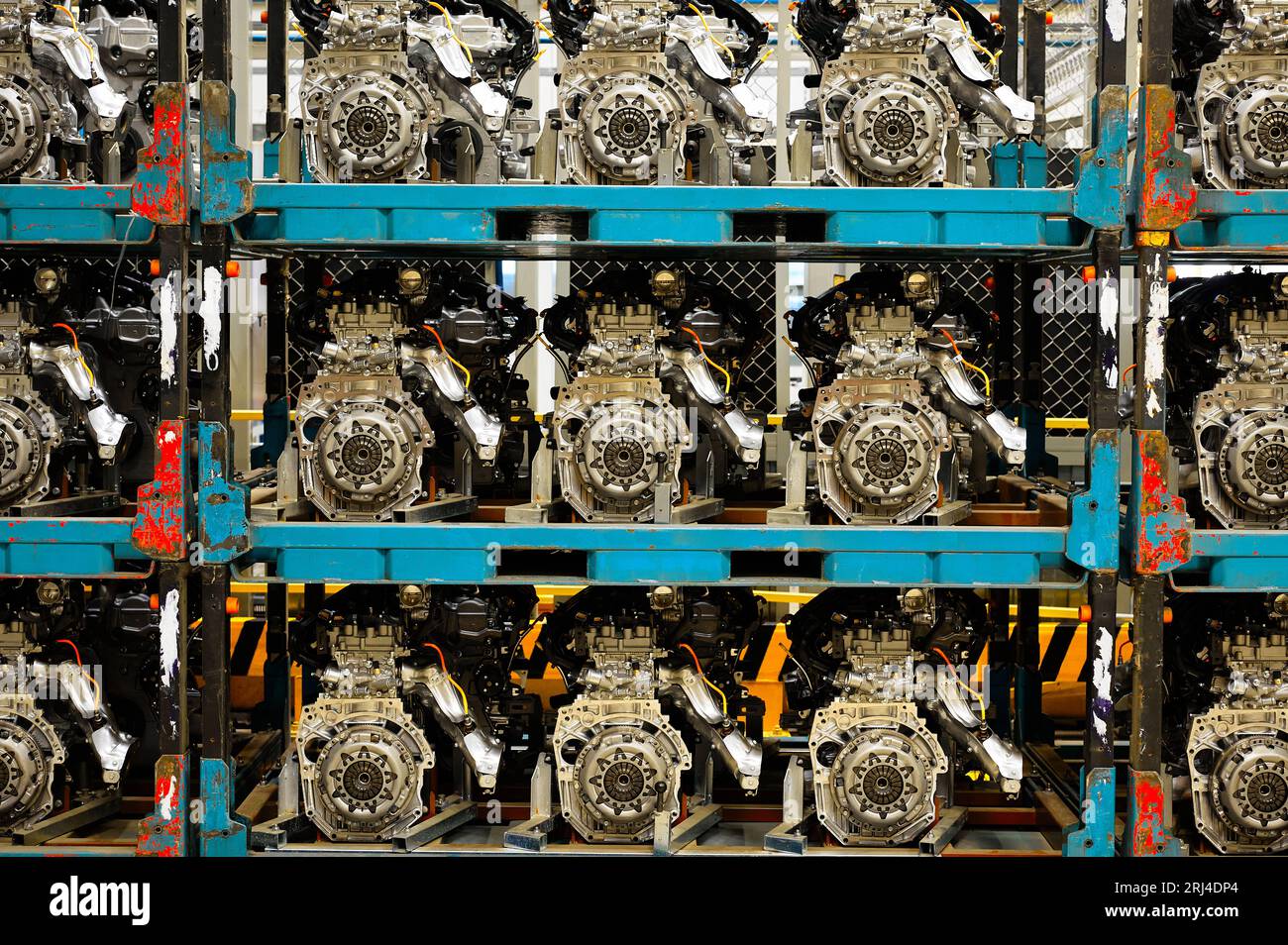 Car internal combustion engines stand on racks in warehouse Stock Photo ...