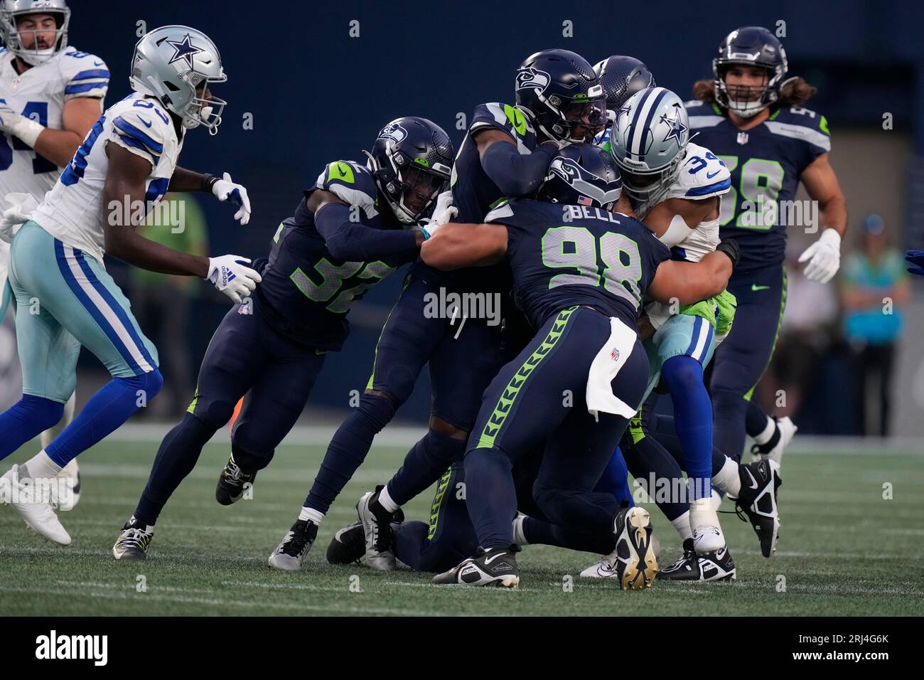 Seattle Seahawks linebacker Levi Bell (98) tackles Dallas Cowboys running back Malik Davis (34 ...