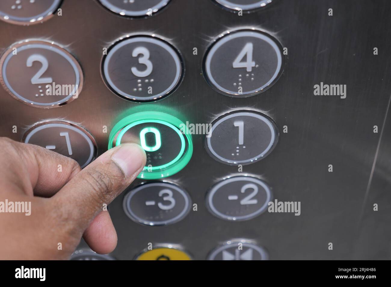 The man push lift button down Stock Photo - Alamy