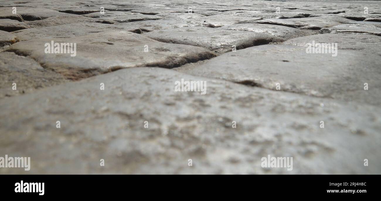 Old stones road pavement, close view background Stock Photo - Alamy