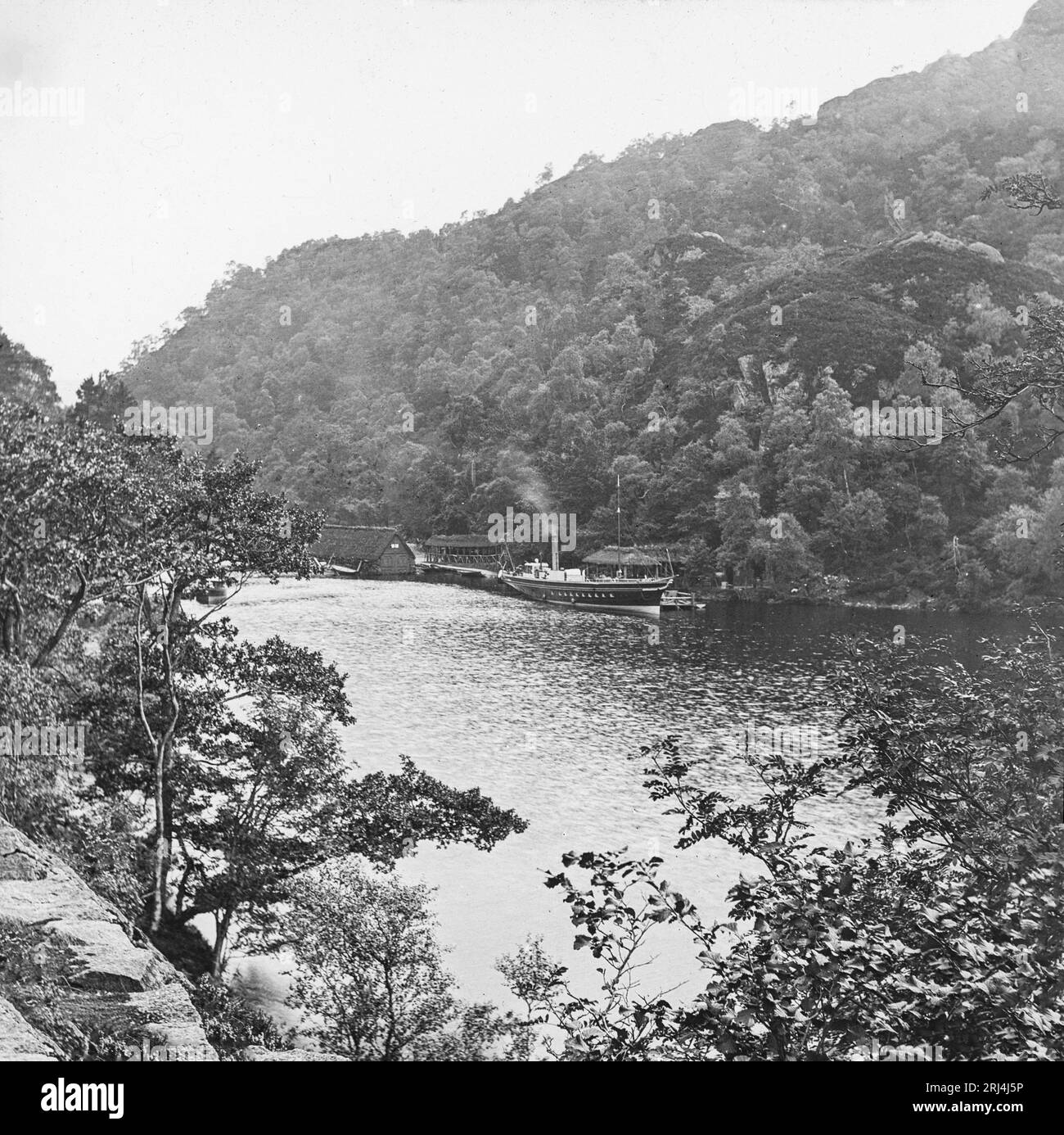 An early 20th century black and white photograph of Loch Katrine in ...