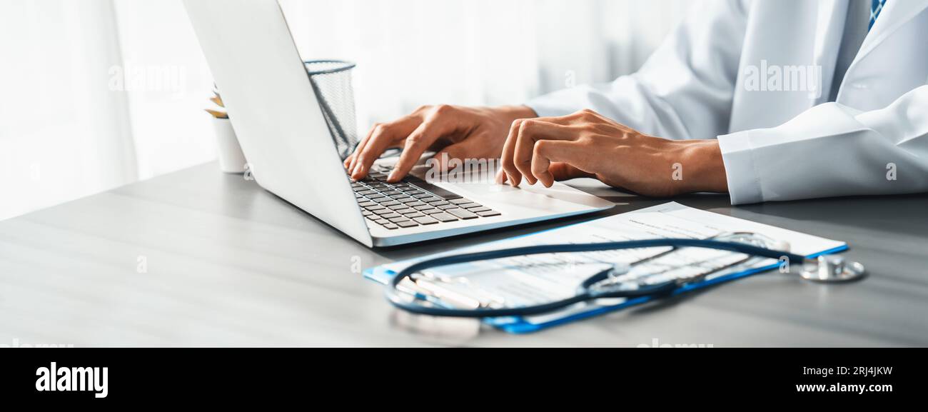 Doctor carefully review detailed medical report with laptop and ...