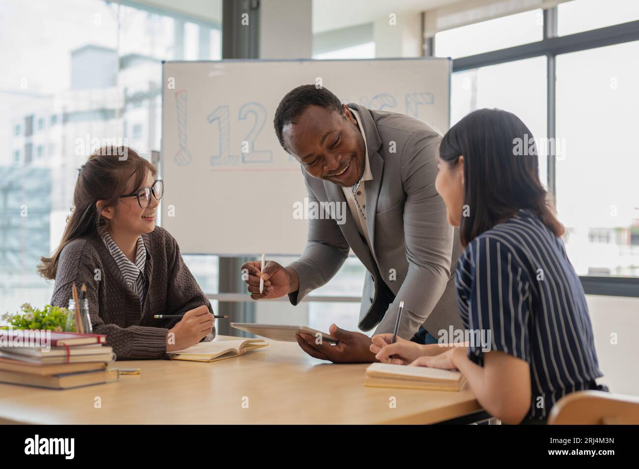 African american male teacher hi-res stock photography and images - Alamy