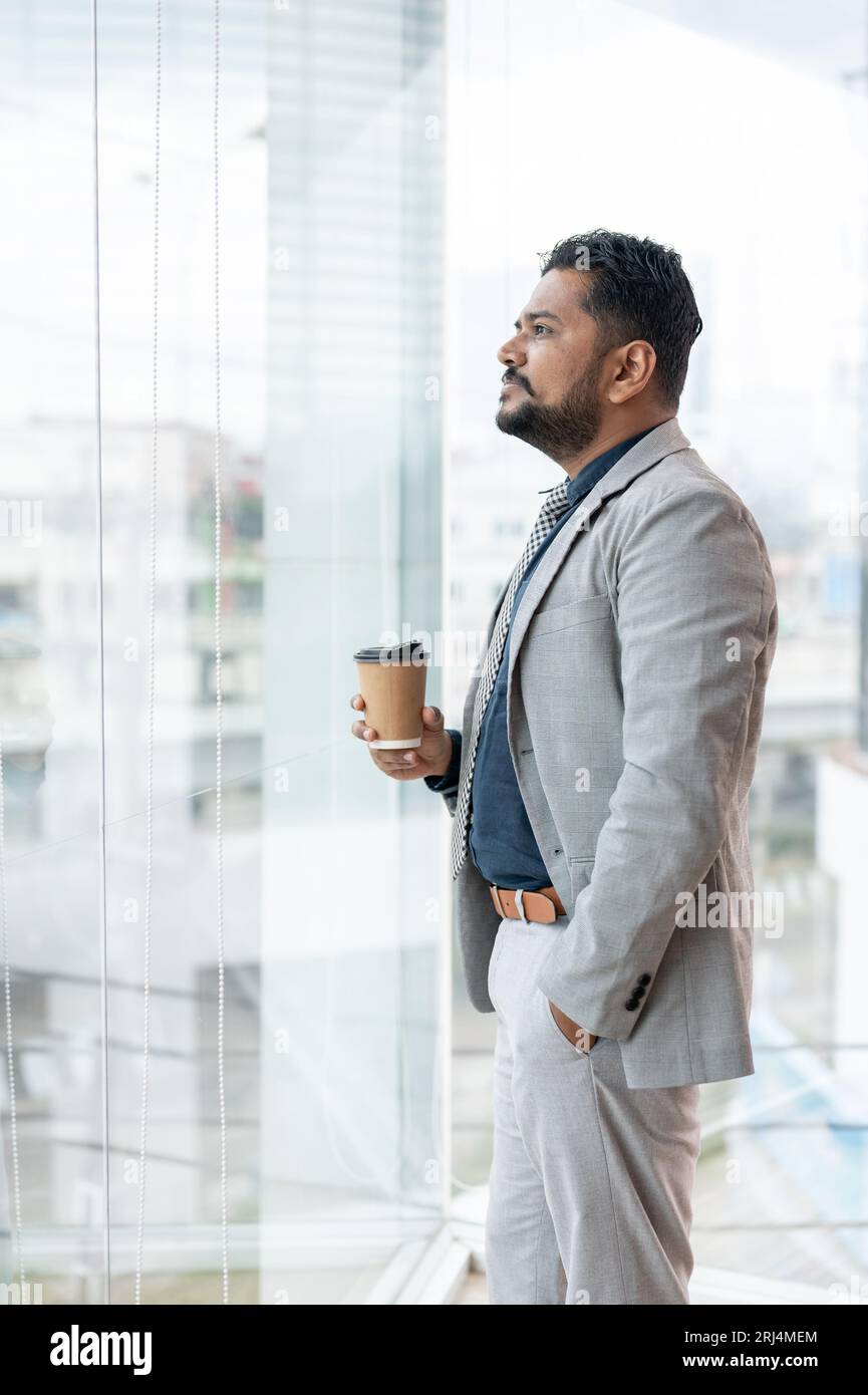A successful and determined Indian-Asian businessman or male CEO in a ...