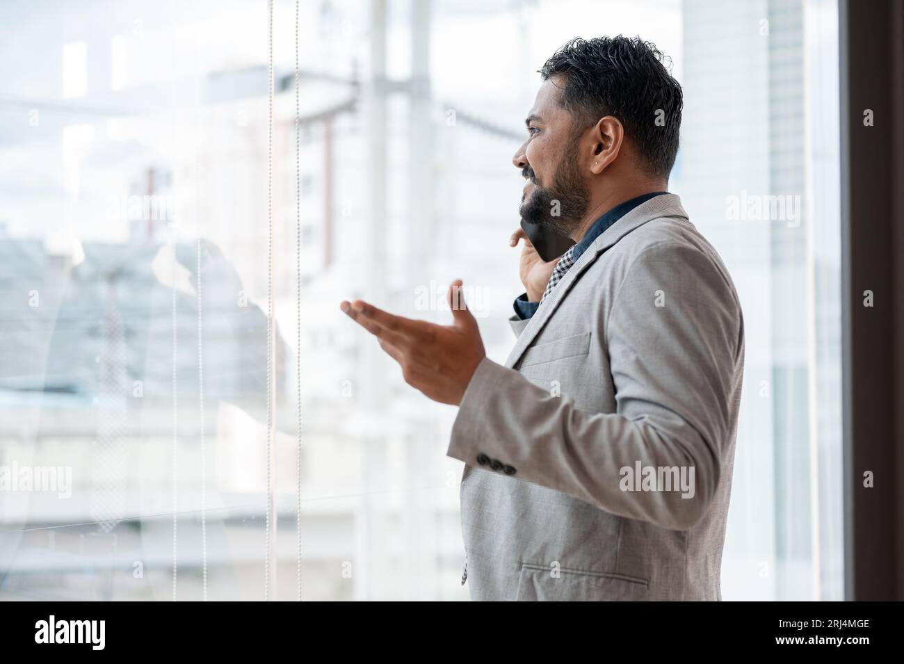 A professional and successful Indian-Asian businessman or male CEO in a ...