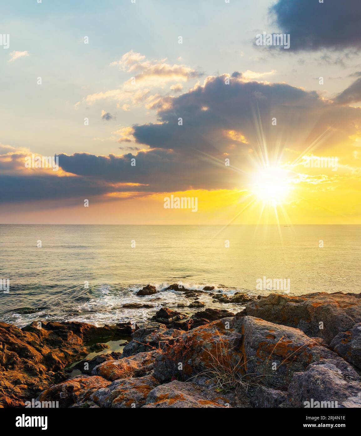 Rocky shore with sunset hi-res stock photography and images - Alamy