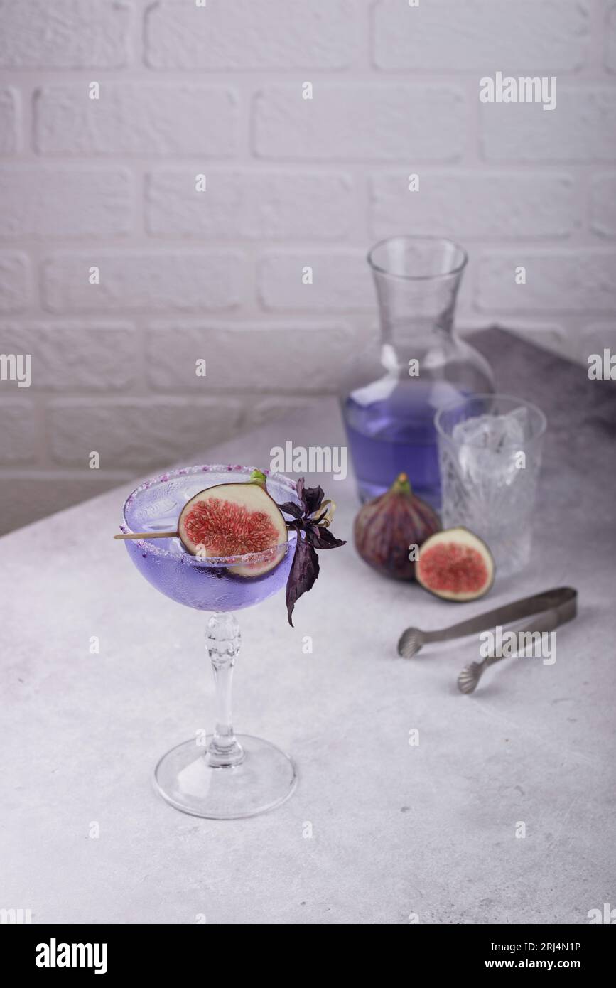 Purple fig cocktail or mocktail in glass Stock Photo - Alamy