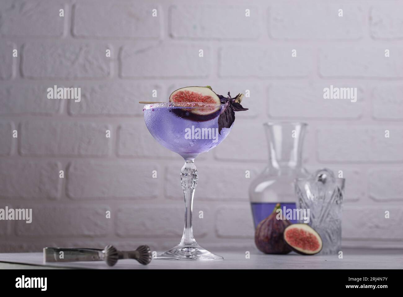 Purple fig cocktail or mocktail in glass Stock Photo - Alamy
