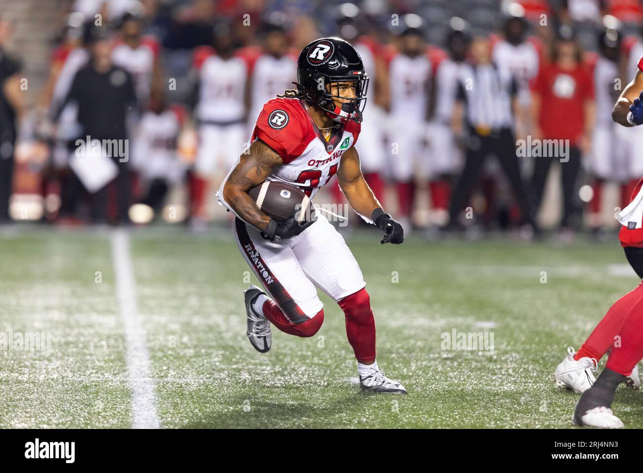 OTTAWA, ON - AUGUST 19: Ottawa Redblacks running back Devonte Williams (31) runs with the ball ...