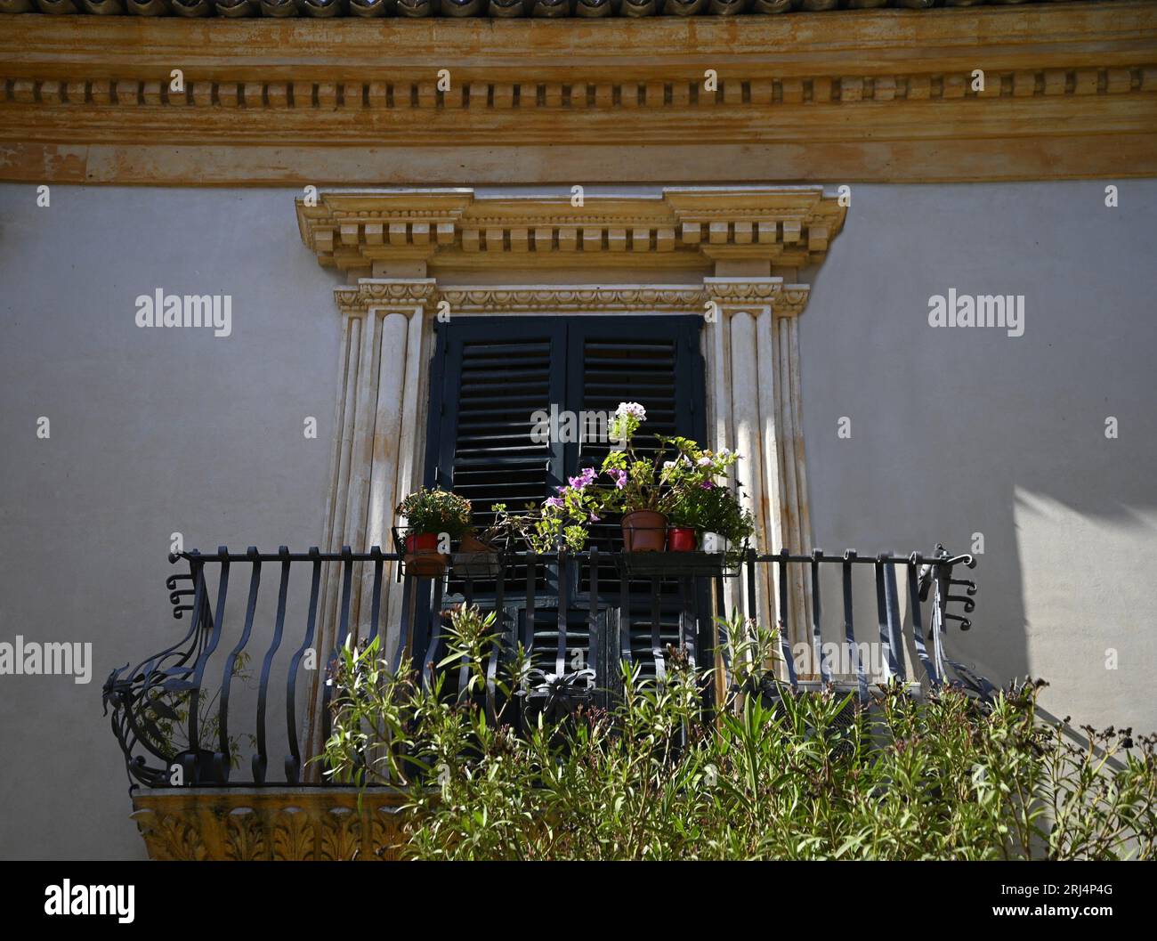 Old Neoclassical house balcony in Scicli Sicily, Italy Stock Photo - Alamy
