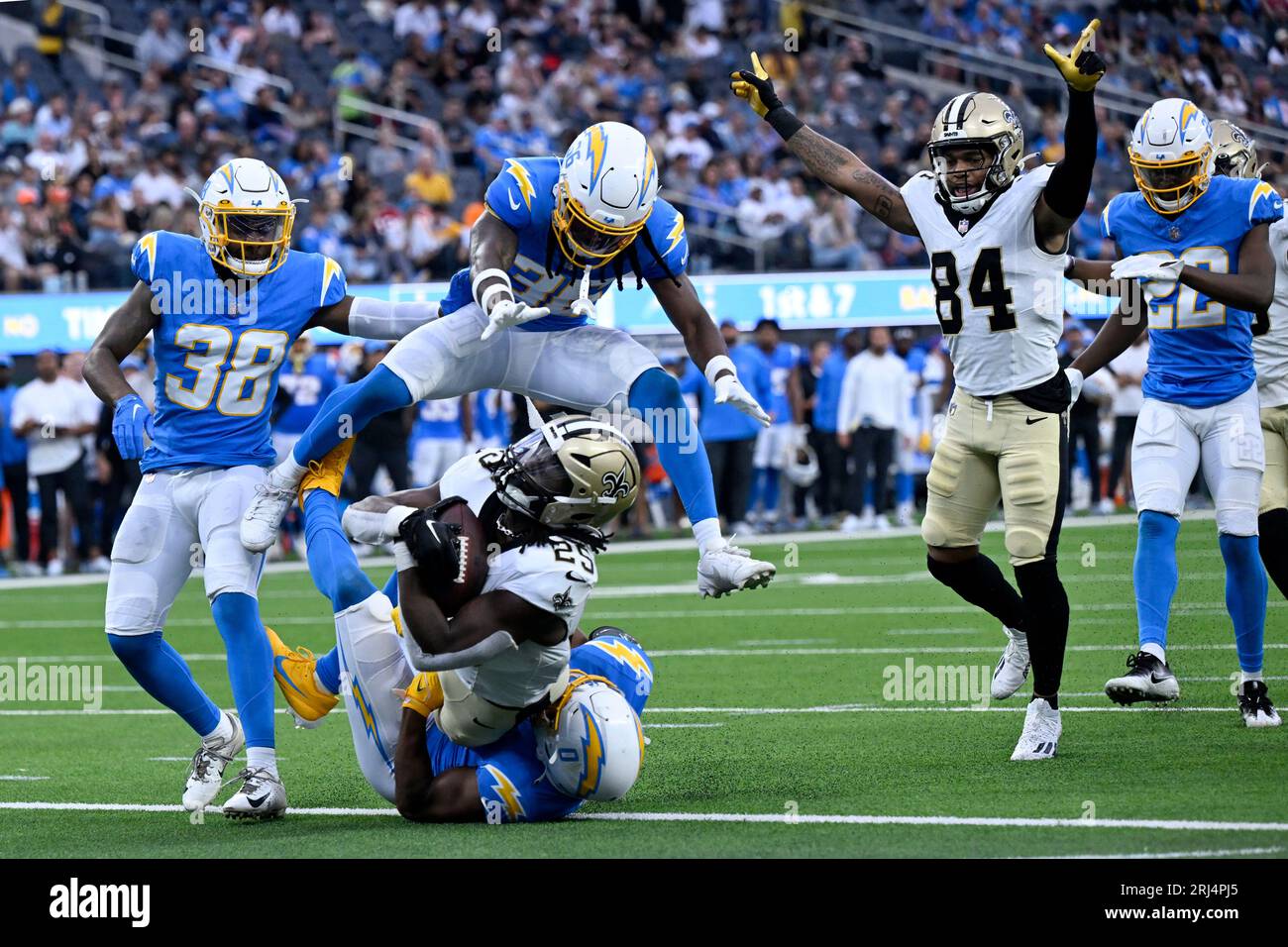 New Orleans Saints running back Kendre Miller (25) puts in a touchdown ...