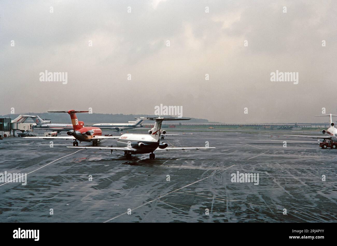 A vintage 1970s colour photograph showing Jet Airliners at an airport ...