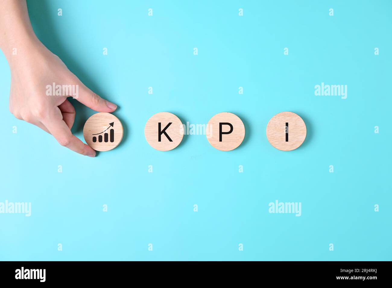 Key performance indicator, Businessman holding wooden cube with KPI ...
