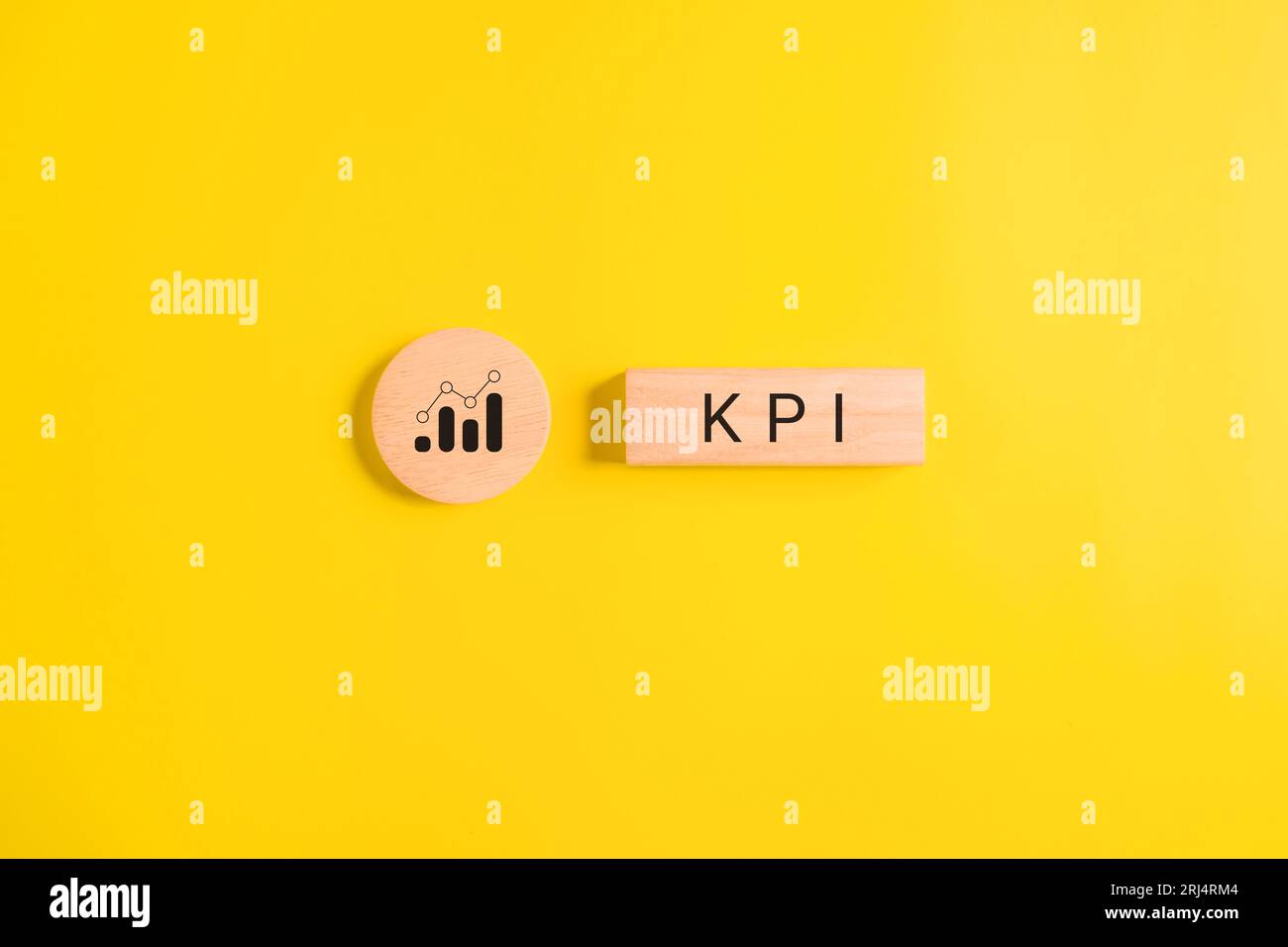 Key performance indicator, Businessman holding wooden cube with KPI ...