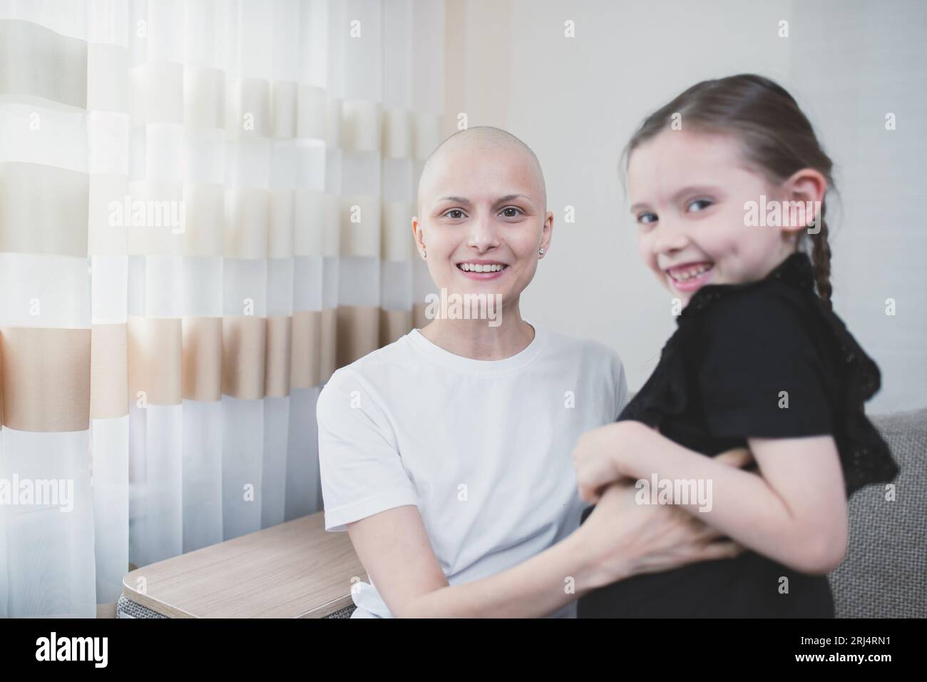 Happy bald woman with alopecia smiling and joyful spending time with ...