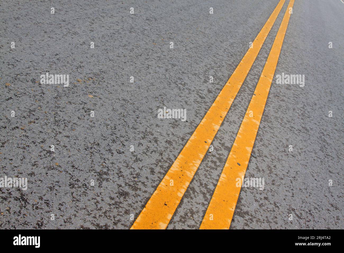 Yellow double line on the asphalt road, north china Stock Photo - Alamy