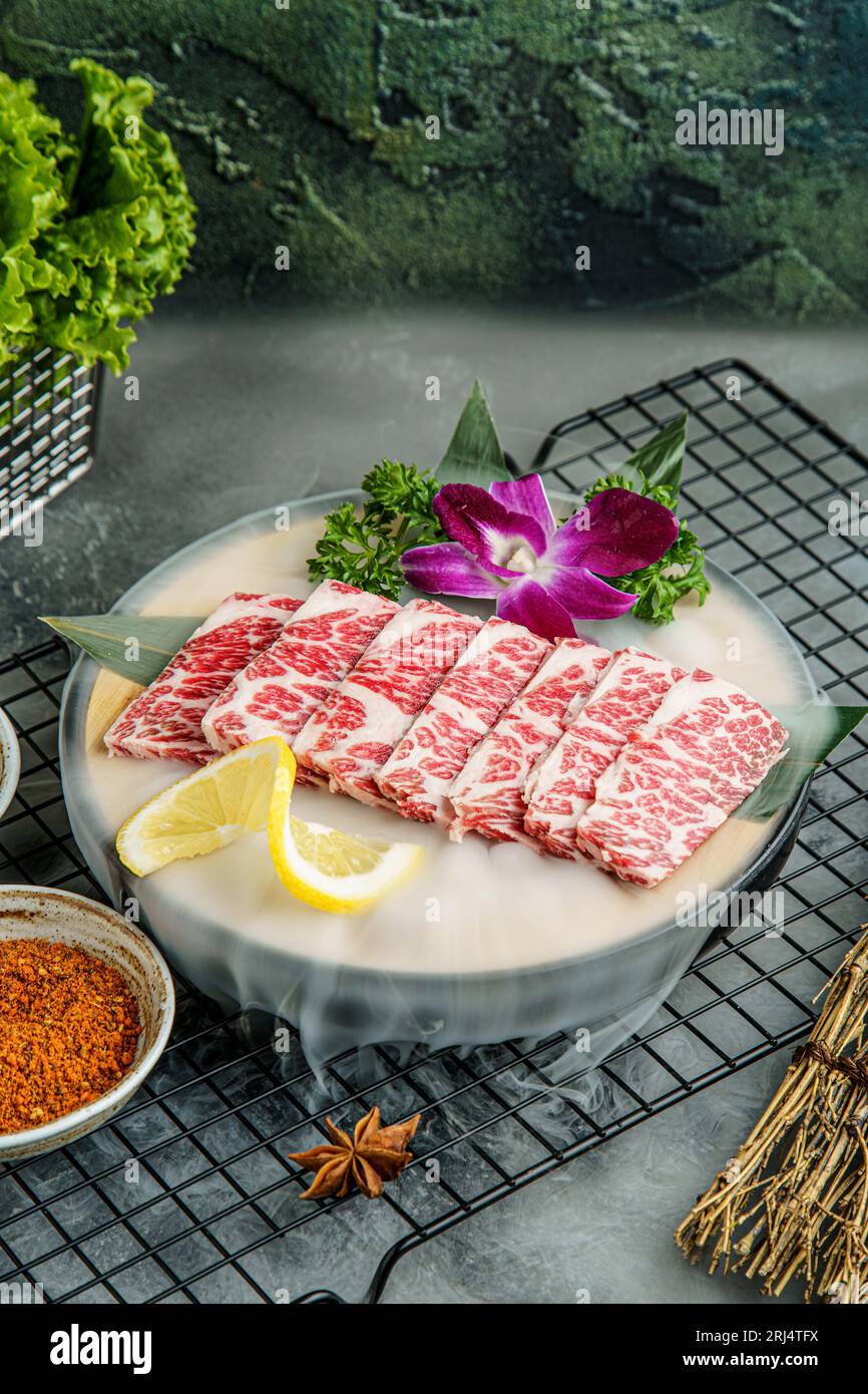 Premium Rare Slices sirloin Wagyu A5 beef with high-marbling texture on food tray served for ...