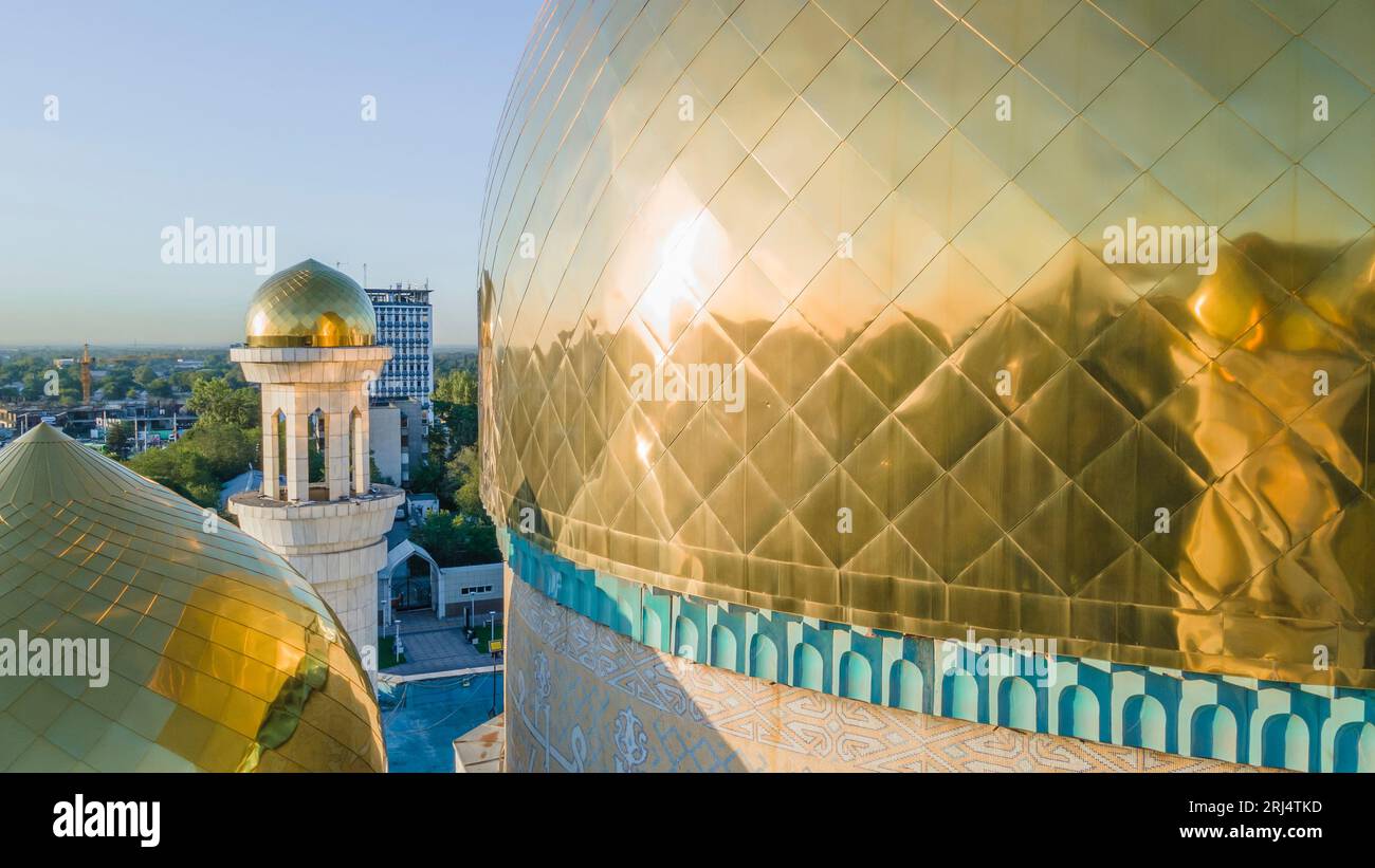 Almaty, Kazakhstan - August 17, 2023: The golden dome and minaret of ...