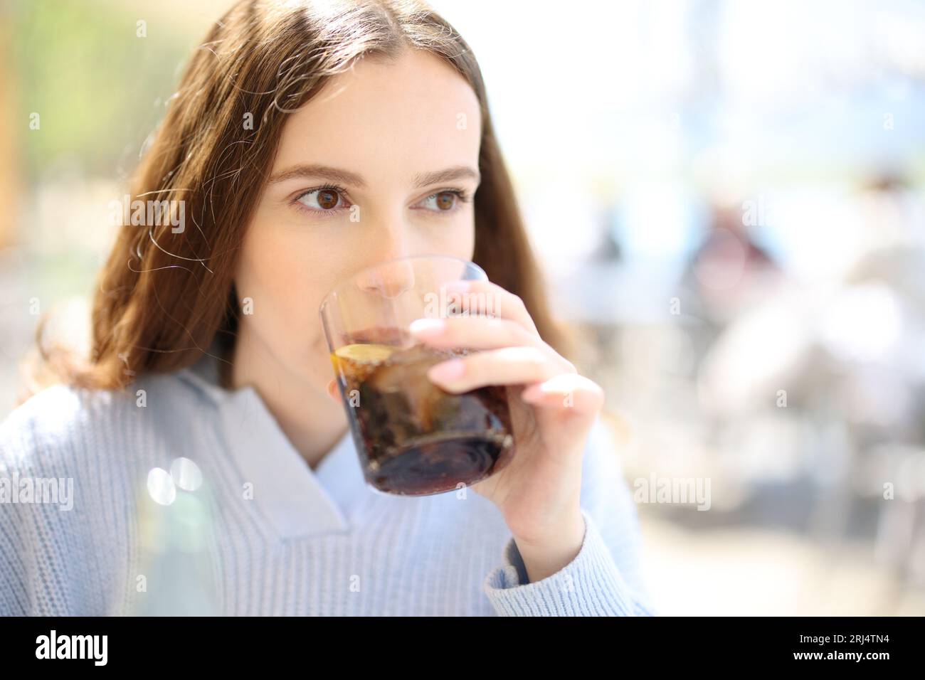 Restaurant customer drinking soda outdoors in a terrace Stock Photo - Alamy