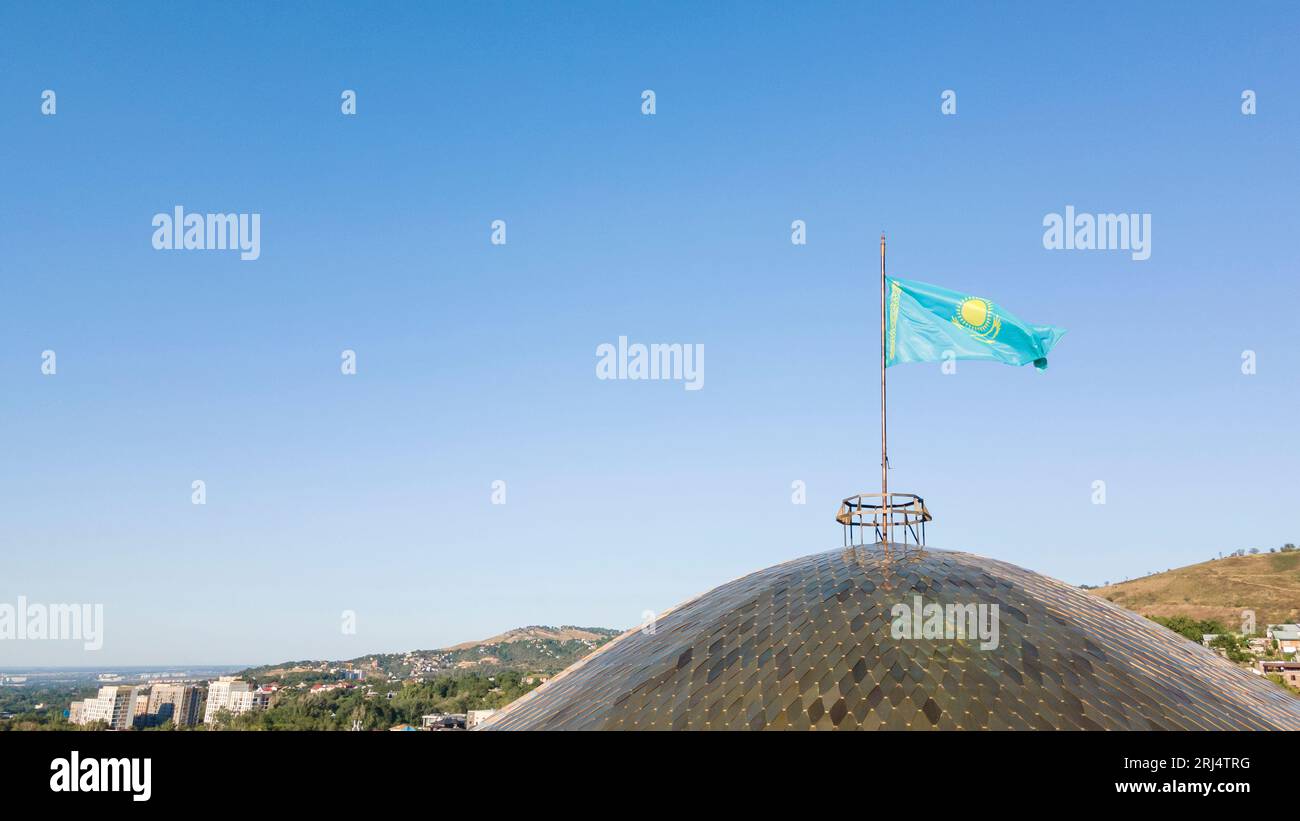 Almaty, Kazakhstan - August 17, 2023: The flag of Kazakhstan floats in ...